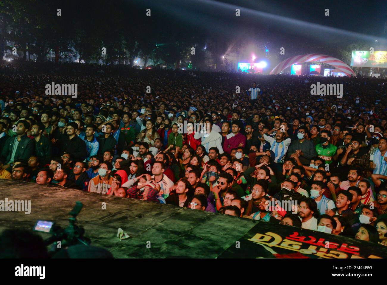 Bangladeshi soccer fans watch on a big screen a public broadcast of the ...