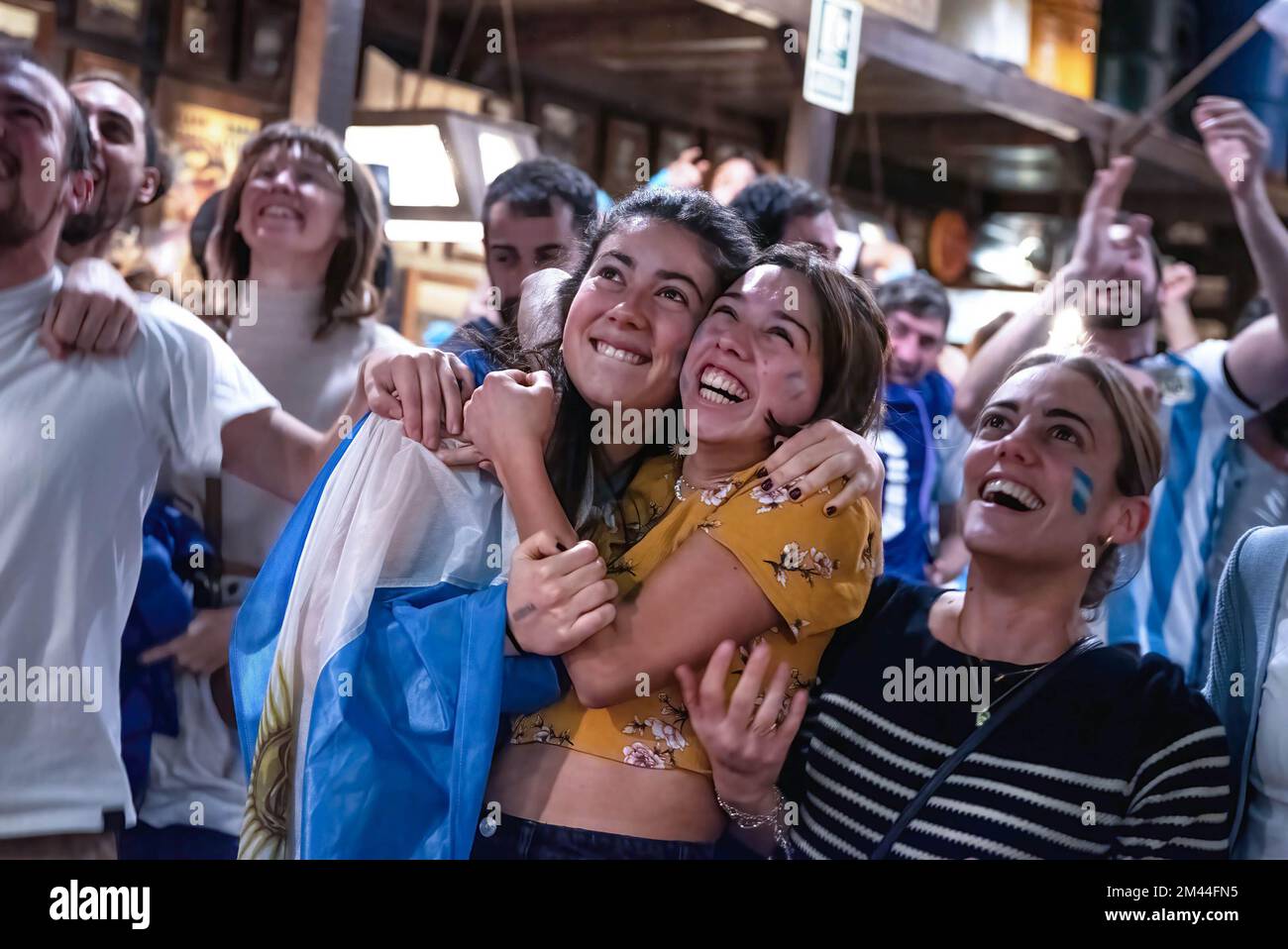 Argentinian women embrace to celebrate the national team's goal against ...
