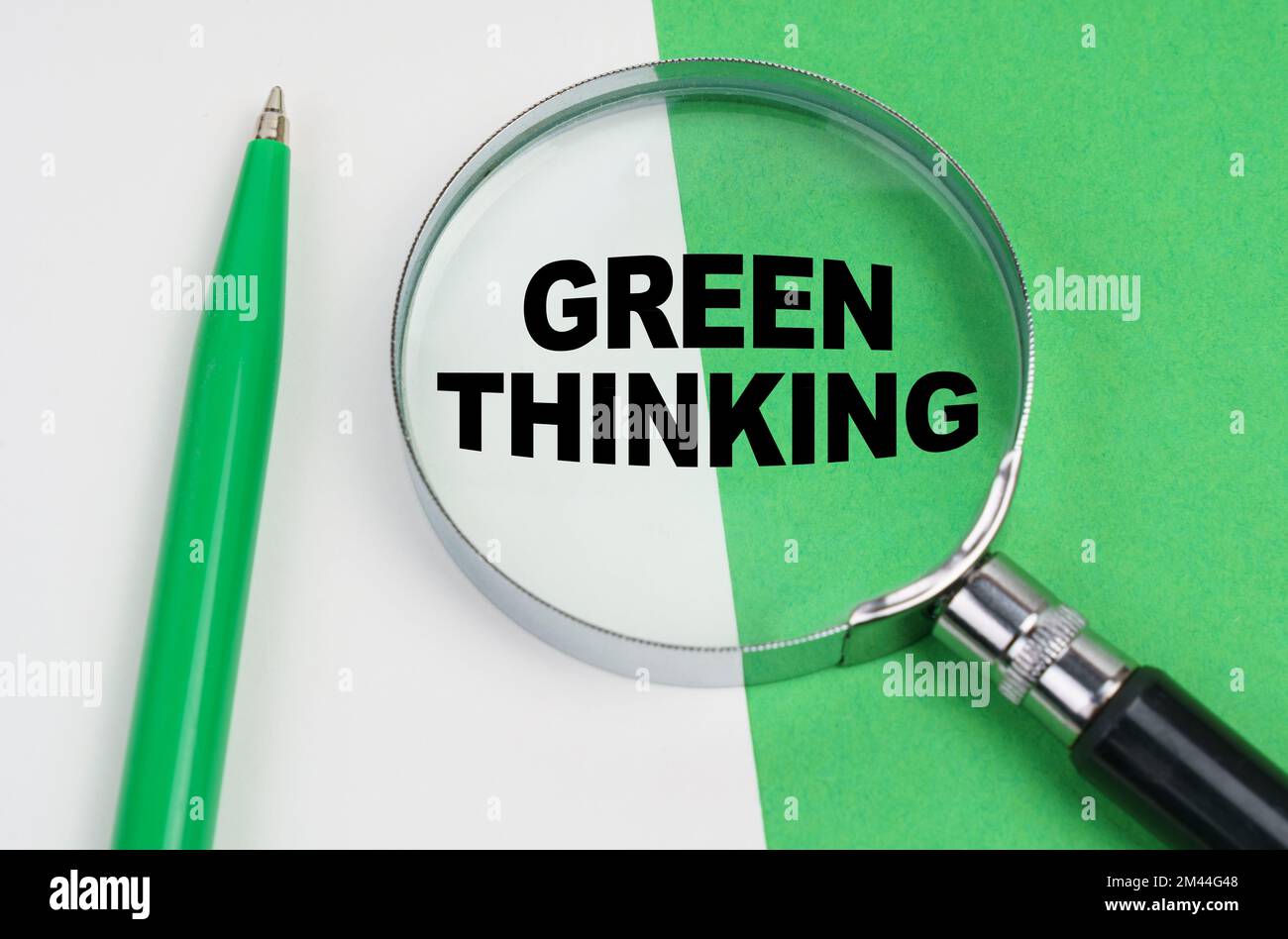 Ecological concept. On a white-green background lies a pen and a ...