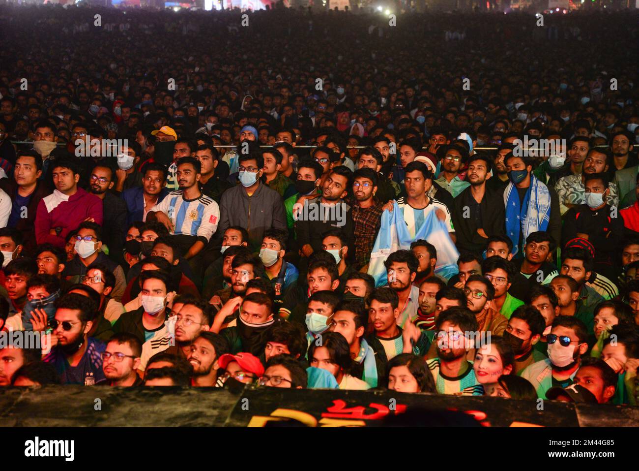Bangladeshi soccer fans watch on a big screen a public broadcast of the ...