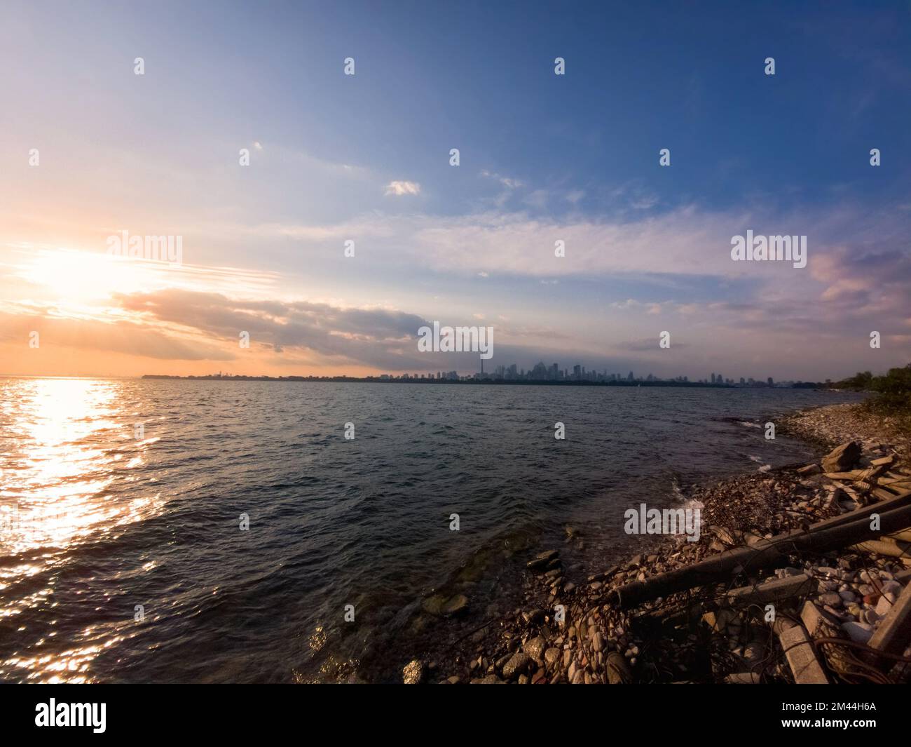 Autumn sunset view across Toronto Harbour of Lake Ontario with foggy ...