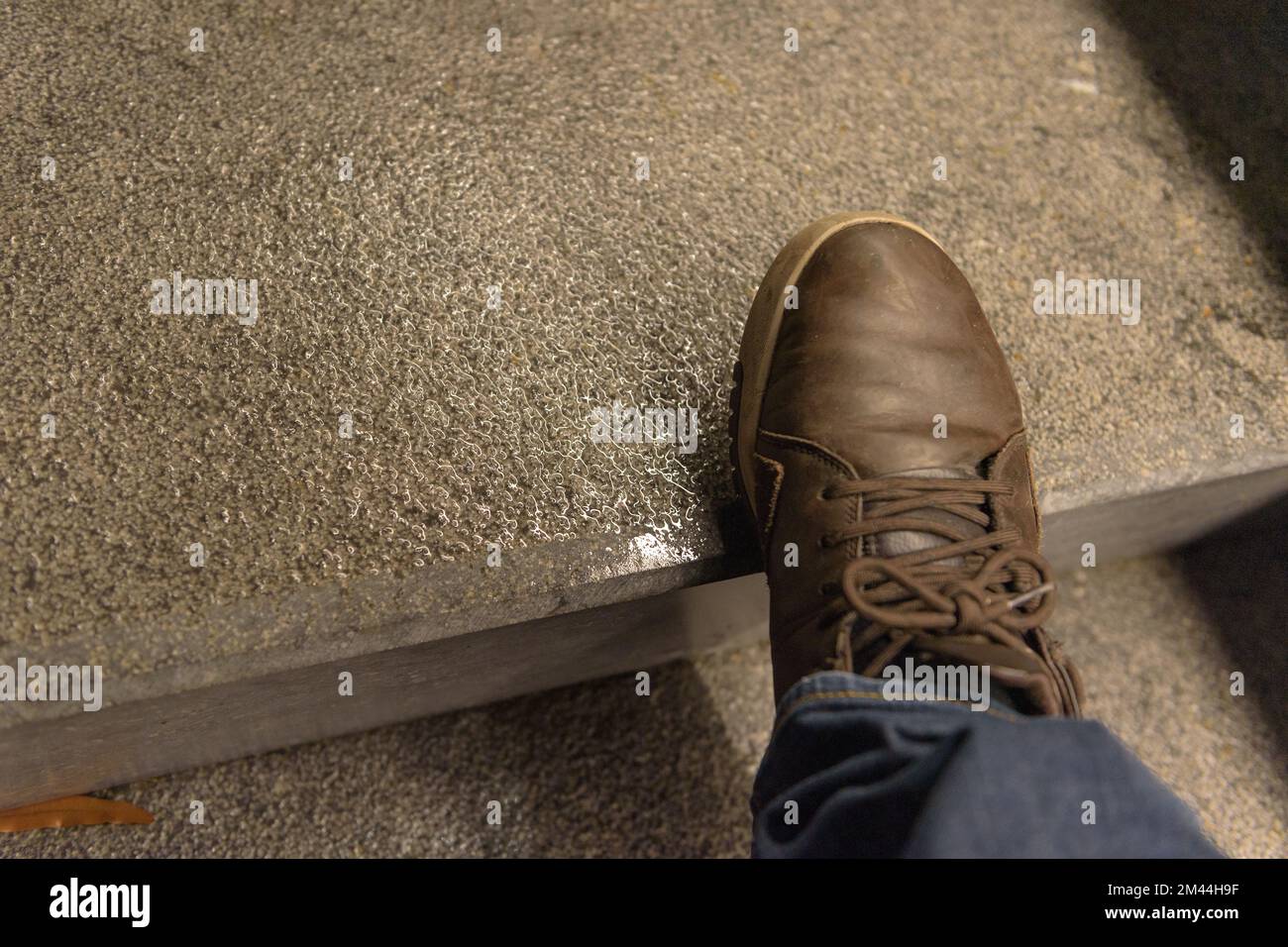 Danger of falling. Slippery steps after rain. close up Stock Photo - Alamy