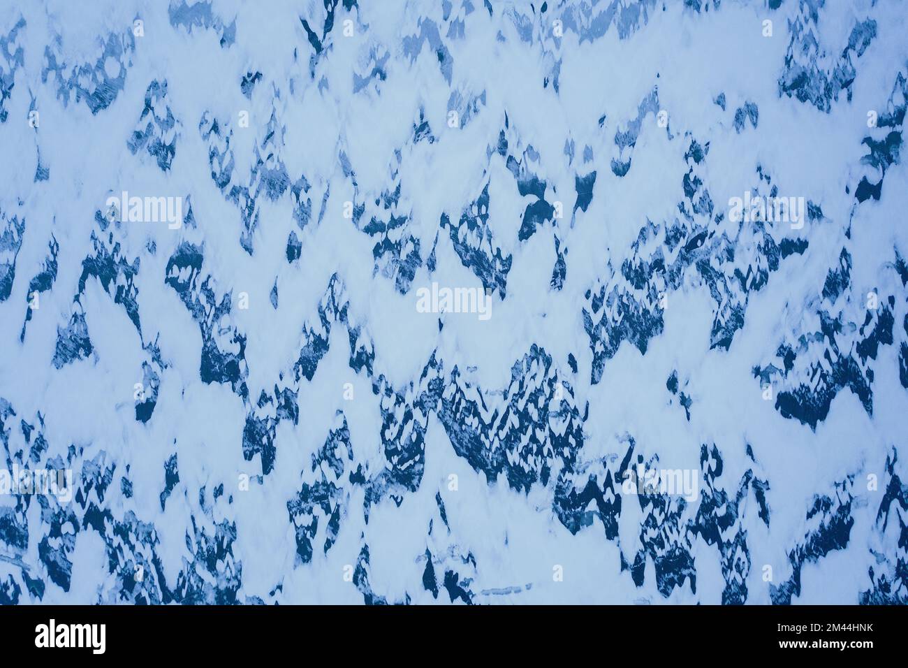 Aerial drone top view of the River covered with ice and snow, The ...