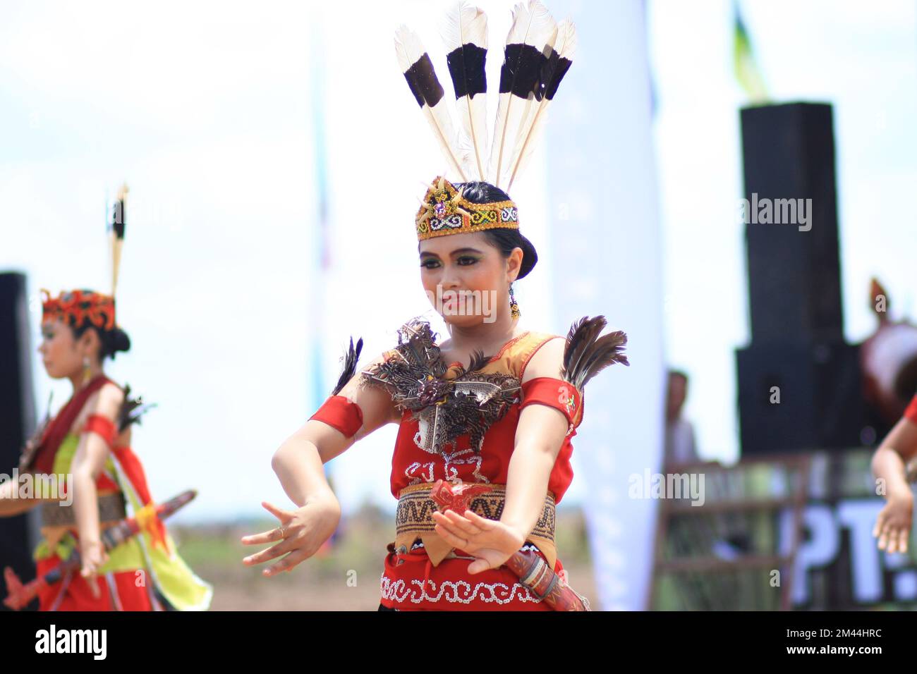 A Dayak woman dancing for a traditional Dayak procession Stock Photo ...
