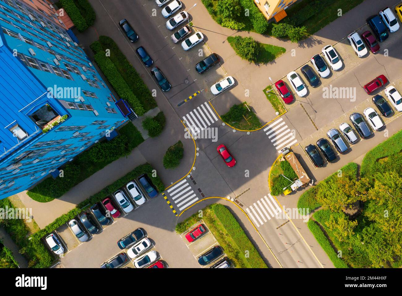 Aerial view from a drone of an intersection with cars in the colorful ...