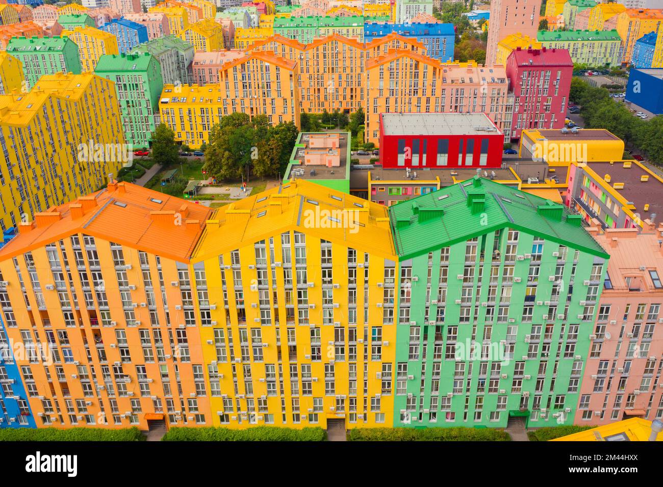 Aerial top view of a drone in the colorful modern houses in rainbow color style, city Comfort ...