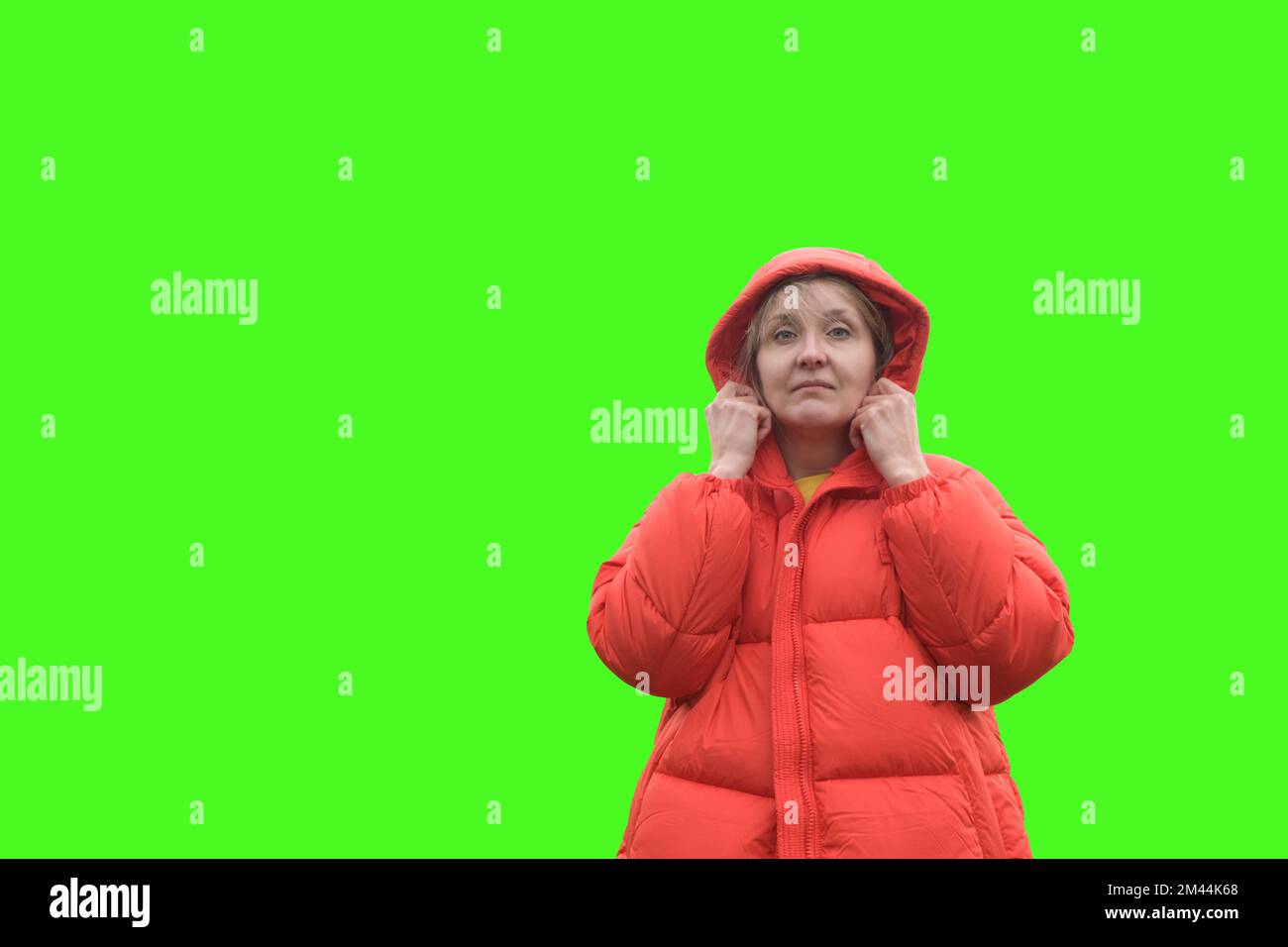 A woman covers herself with a hood in the rain. green screen Stock ...