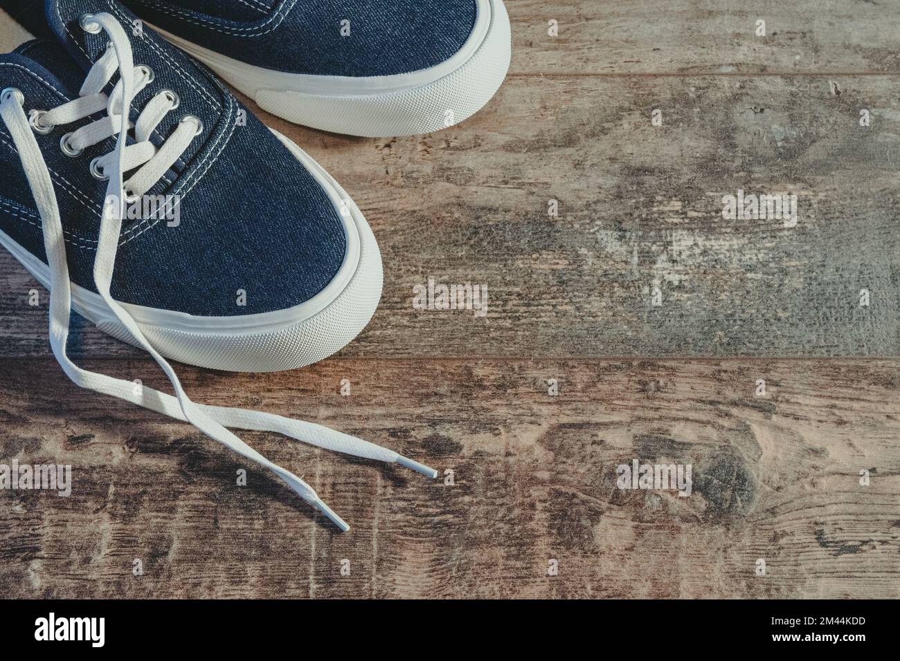 Jeans sneakers. New denim sneakers on a beautiful vintage chalkboard ...