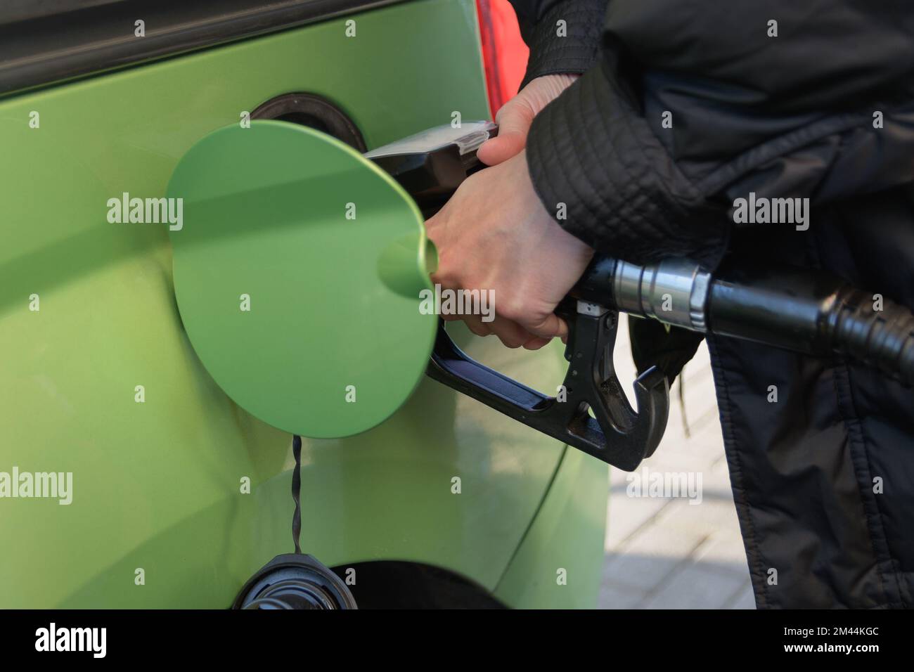Filling up the car. Woman filling petrol in gas station. Close up Stock ...