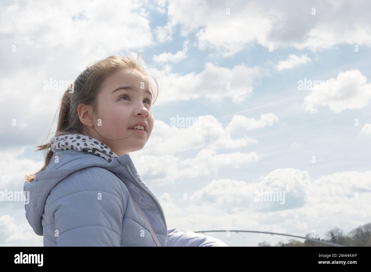 Rain or not. Teenage girl hoping for good weather. Uncertain weather ...
