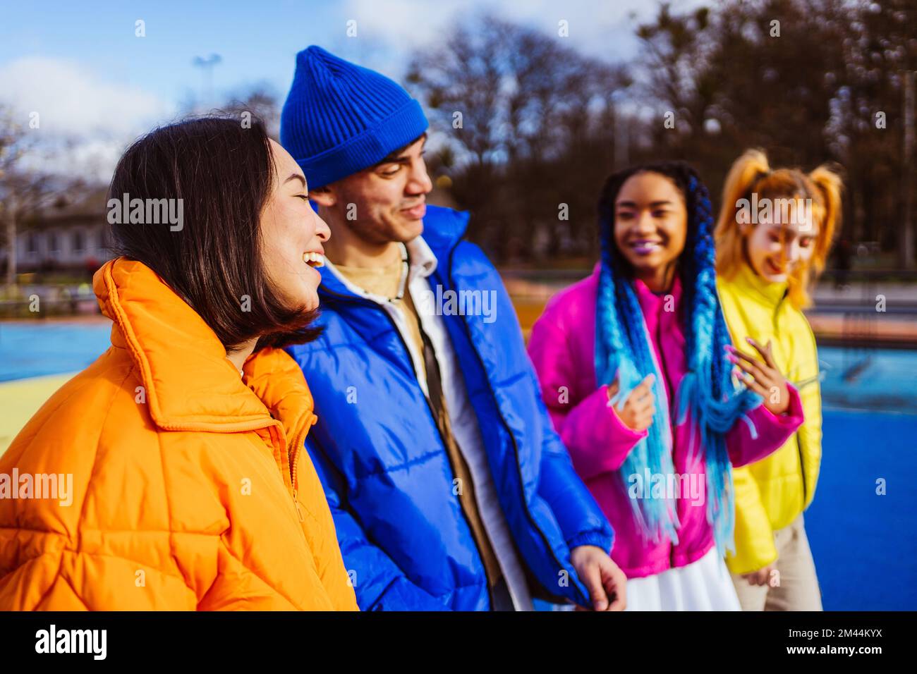 Multiracial group of young happy friends meeting outdoors in winter ...