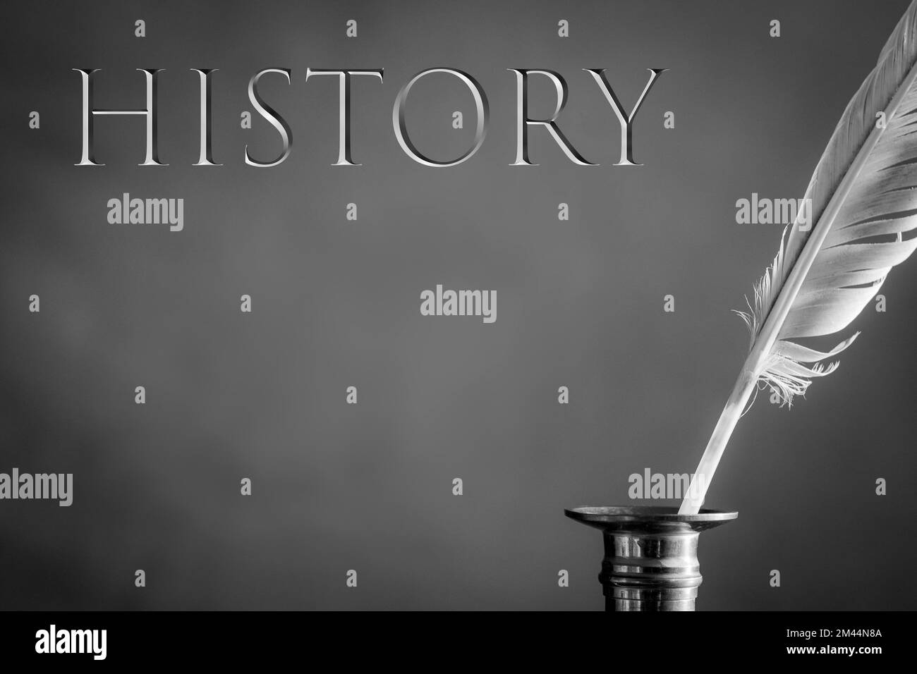 Quill pen and inkwell on a dark background. History concept for ...