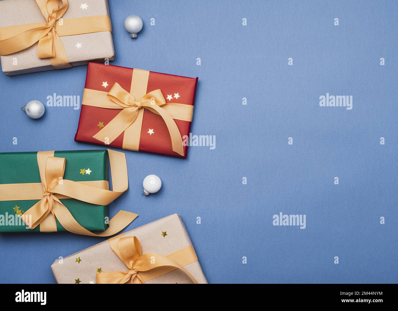 Colorful presents with ribbon blue background Stock Photo - Alamy
