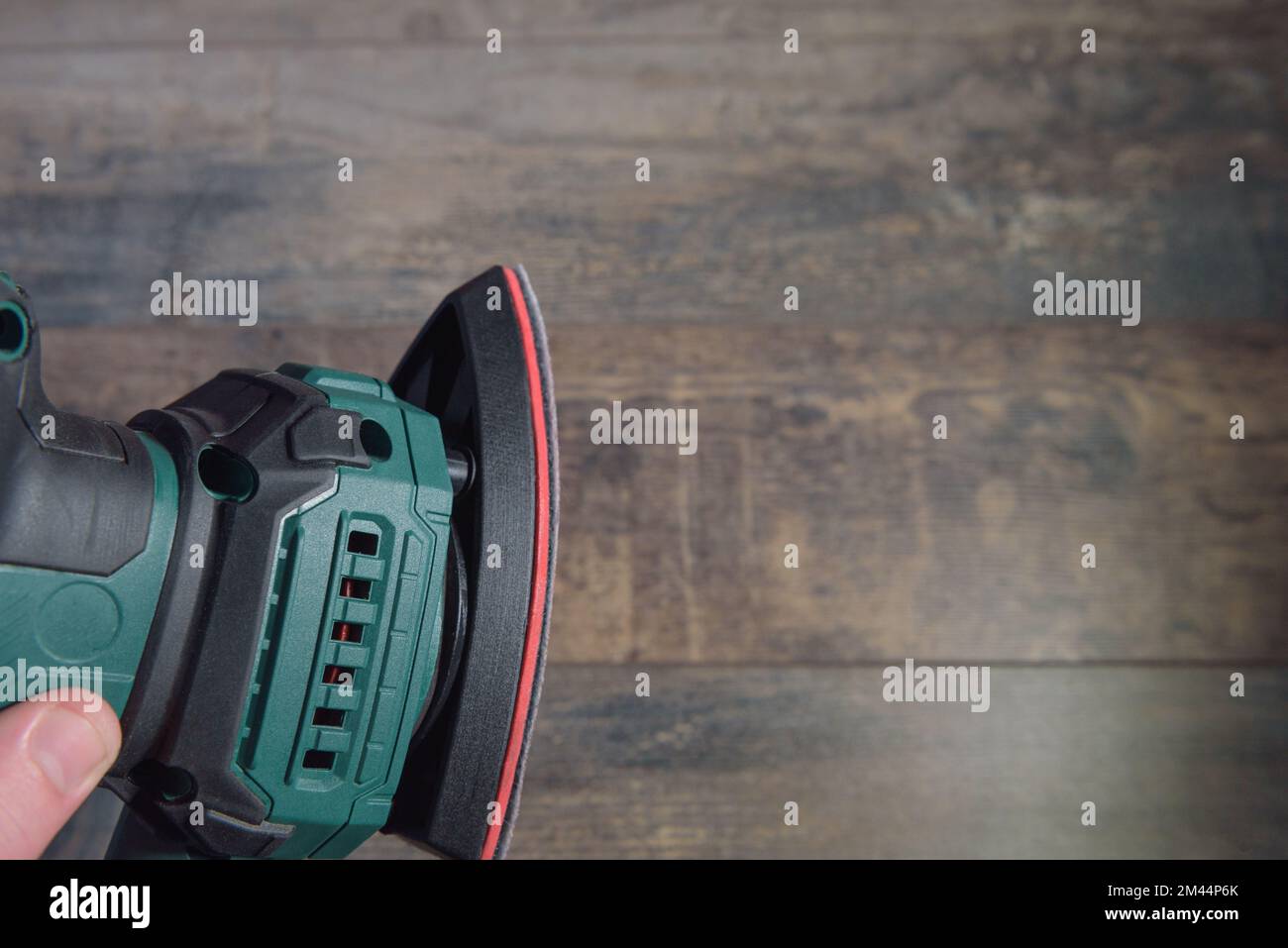 Sander machine in the hand and old texture wood with copy space Stock ...