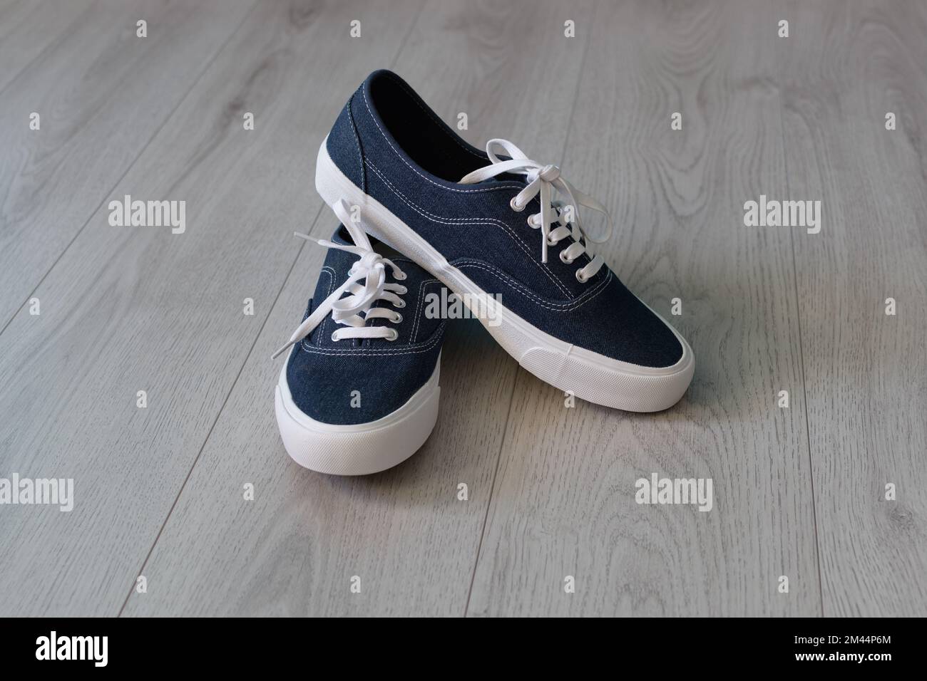 Denim sneakers. New denim sneakers on the floor. Ready to travel Stock ...