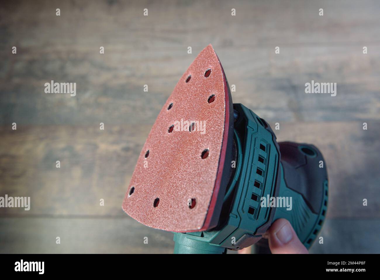 Sander machine in the hand and old texture wood - Close-up Stock Photo ...