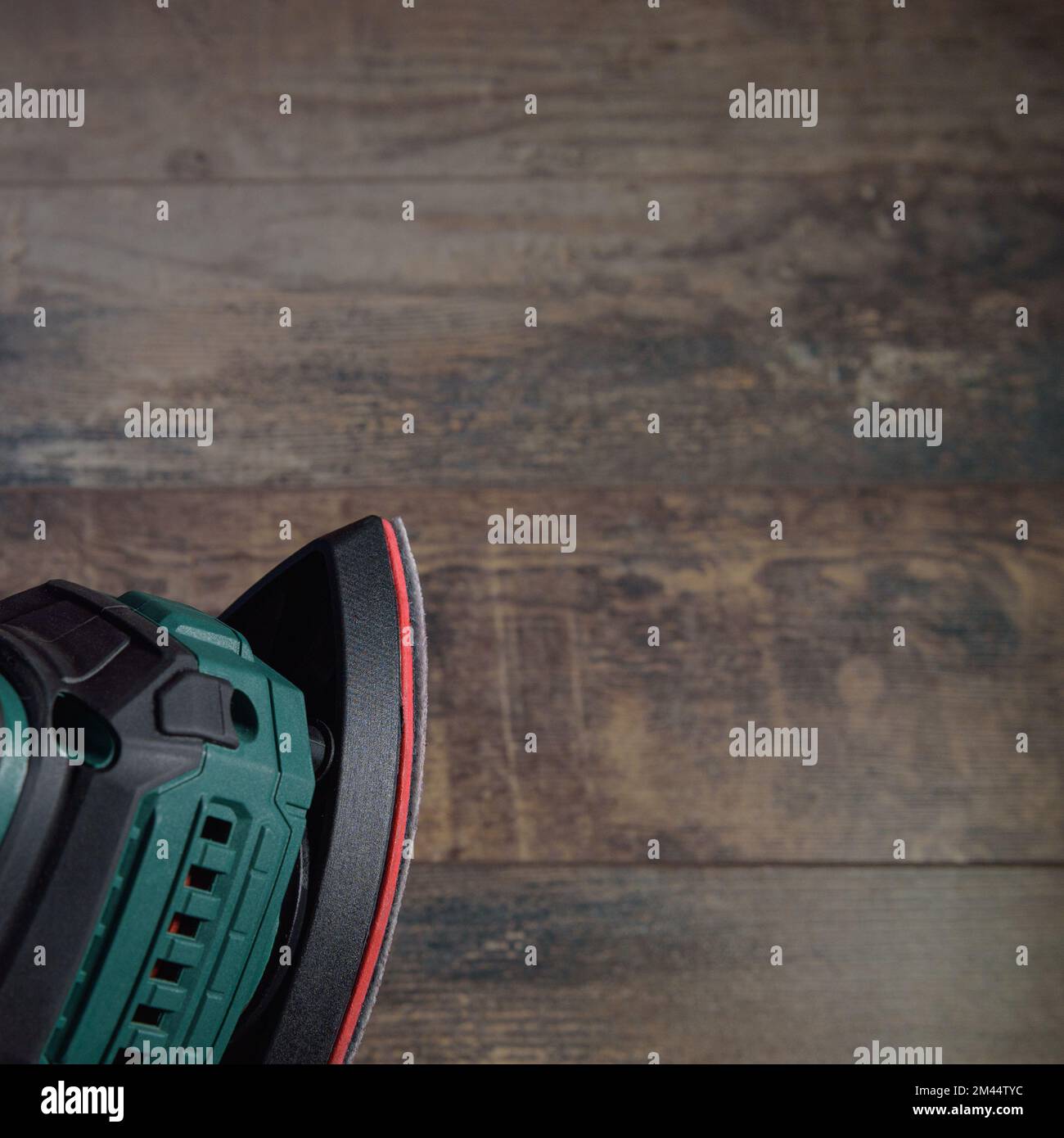 Sander machine in the hand and old texture wood. Square format Stock ...