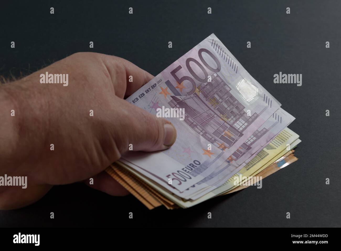 Cash euro money. The hand holding large european banknotes payment ...