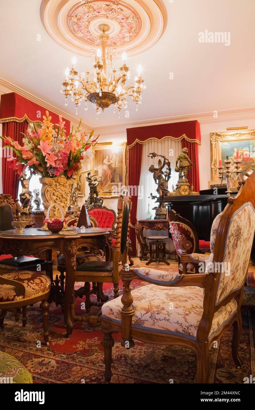 Antique furniture and furnishings adorn a living room inside a ...