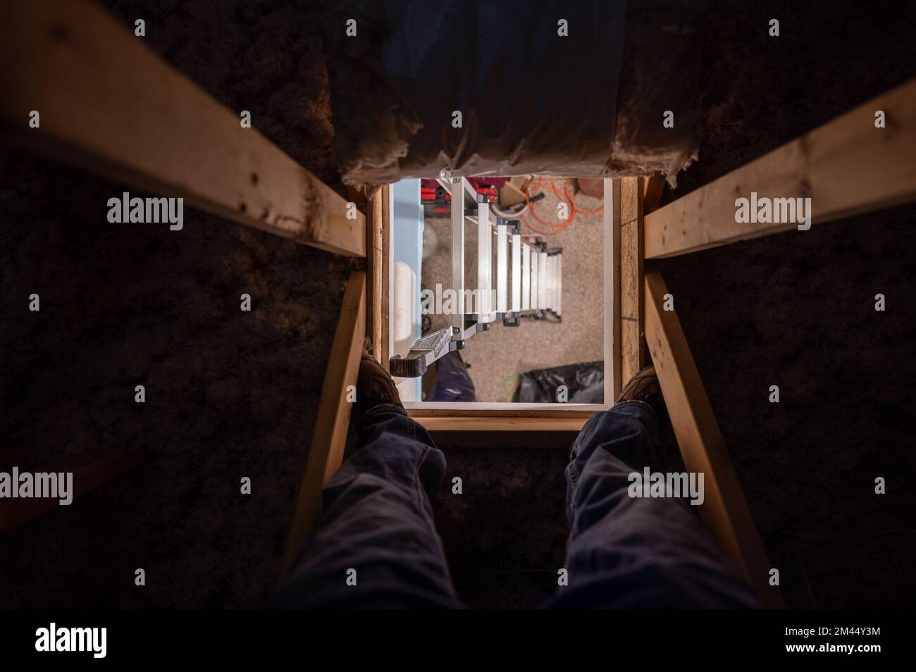 Looking down through the access opening to an attic with the ladder underneath Stock Photo - Alamy