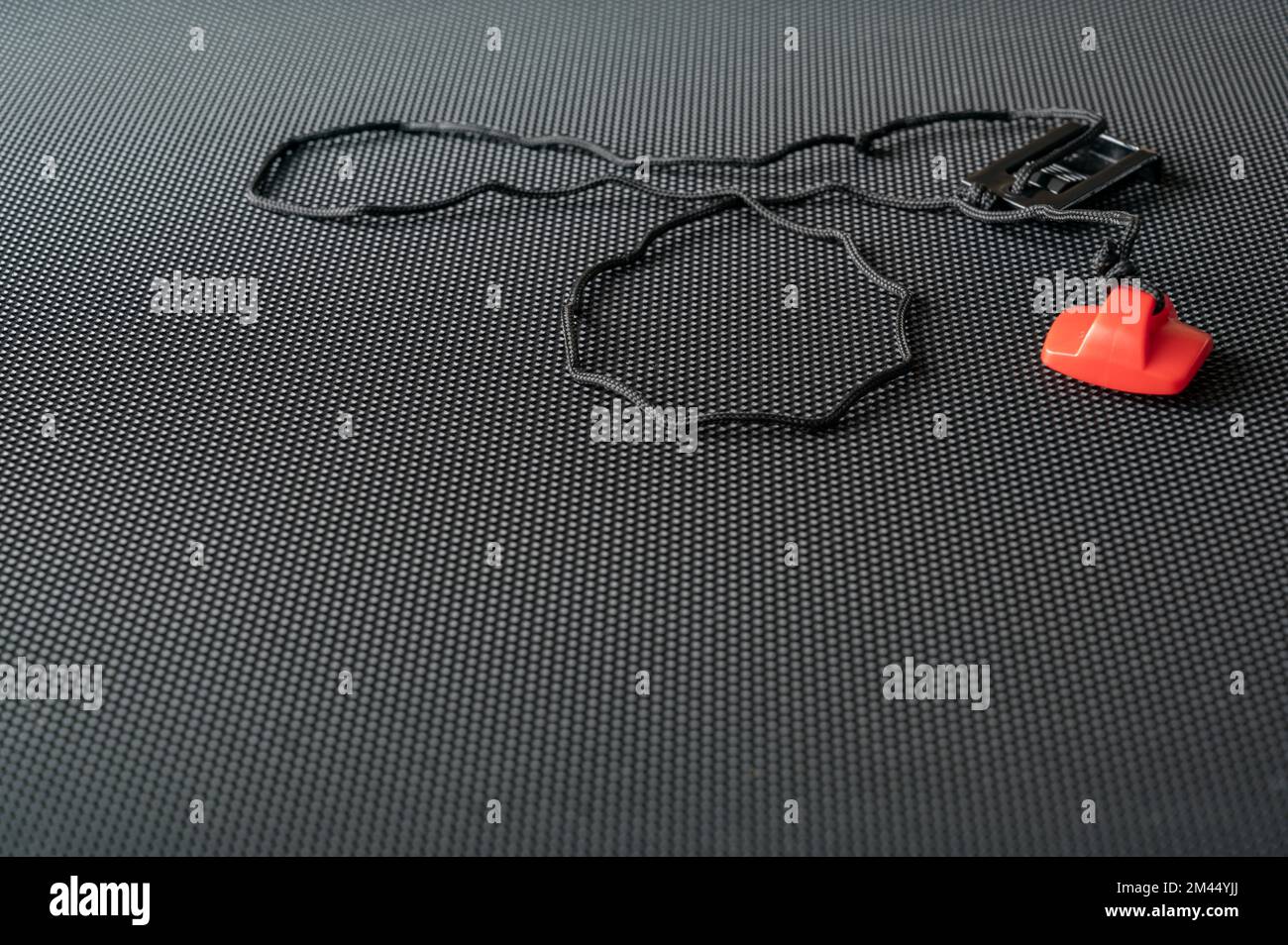 Focus on exercise equipment emergency stop laying on a treadmill belt ...