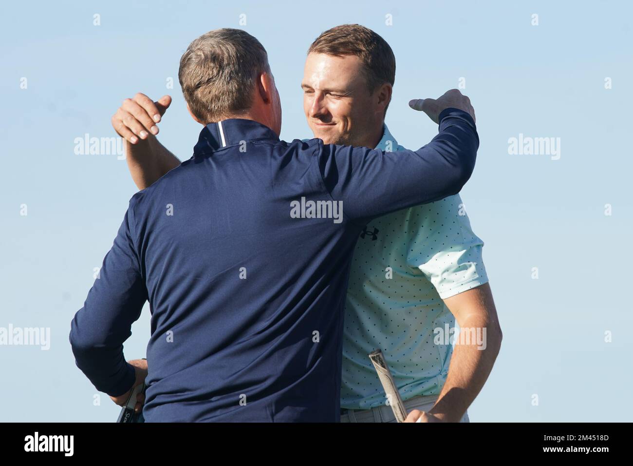 Orlando, Florida, USA. 18th Dec, 2022. Jordan Spieth (R) shares a hug ...