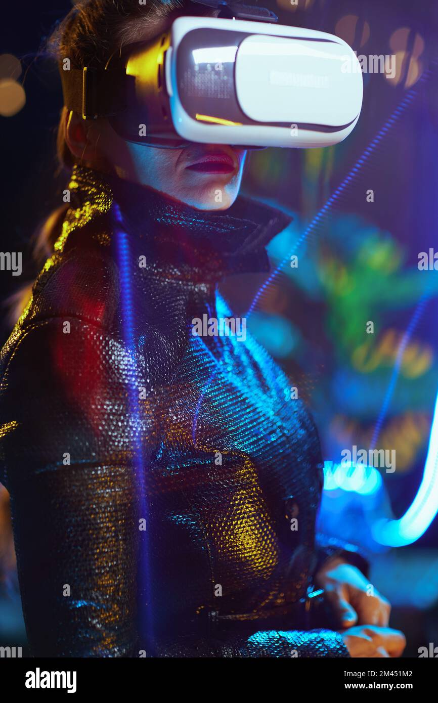 Portrait of stylish woman in metaverse in vr goggles Stock Photo - Alamy