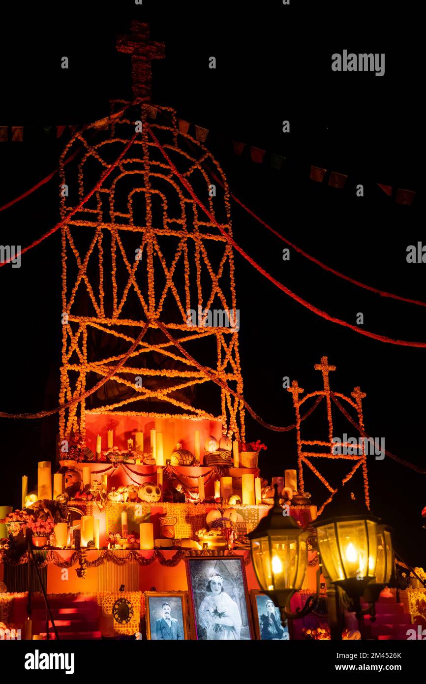 Dead altars Mexican culture at night with lighted candles, candles ...