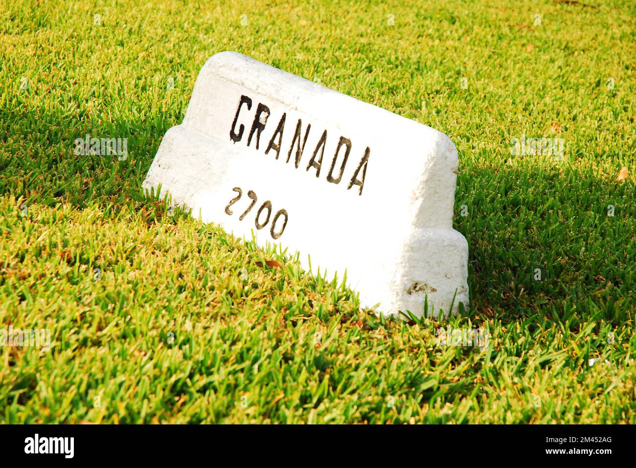 A stone marker is a unique street sign in Coral Gables, Florida, near ...