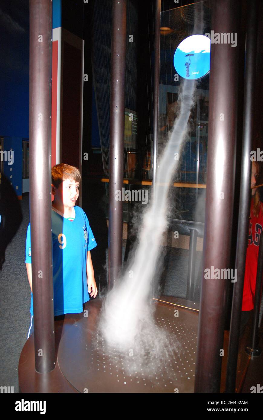 A Young Child is Amazed at a Demonstration of a Tornado formation ...