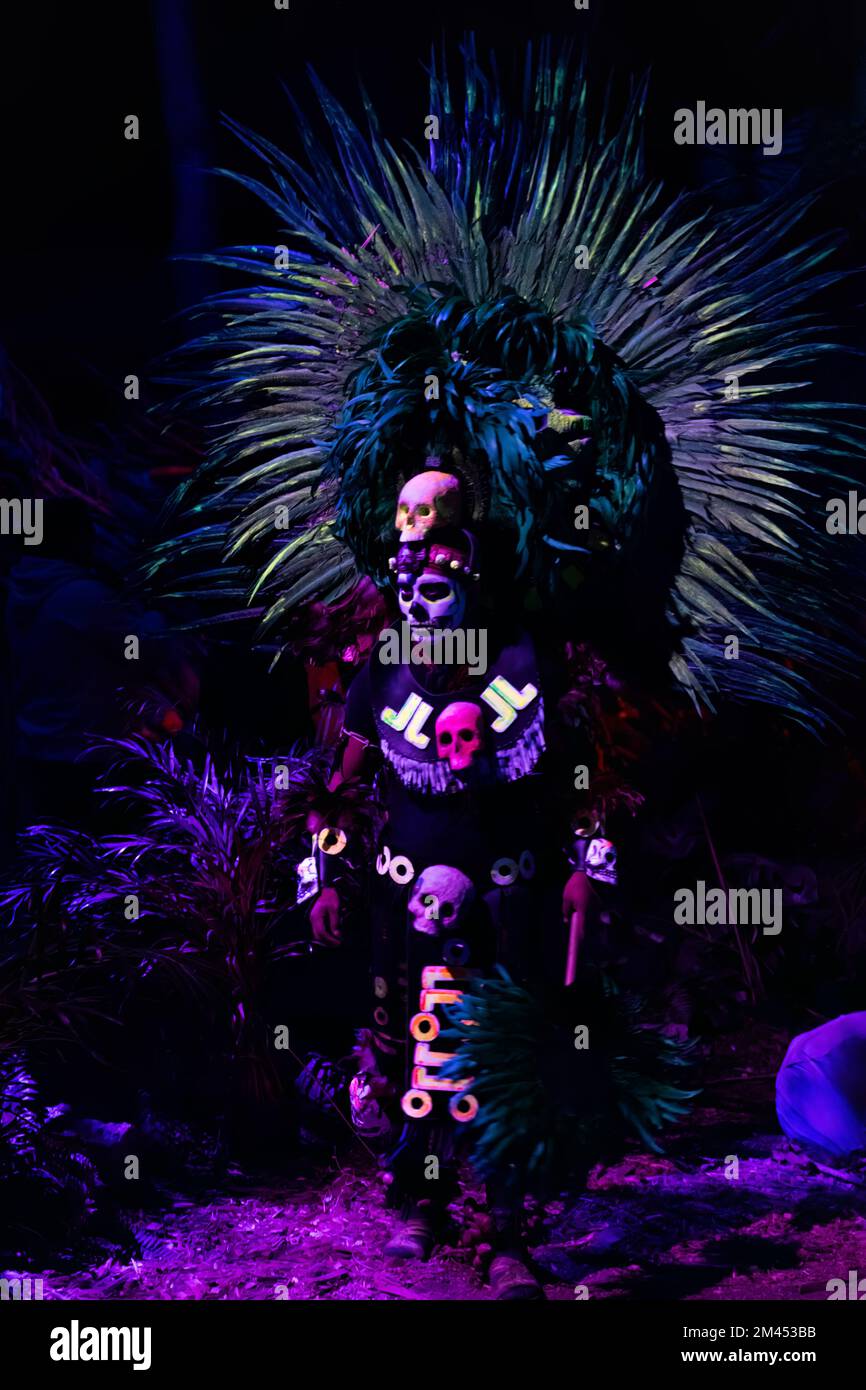 day of the dead mexican tradition man with neon headdress, dancing at ...