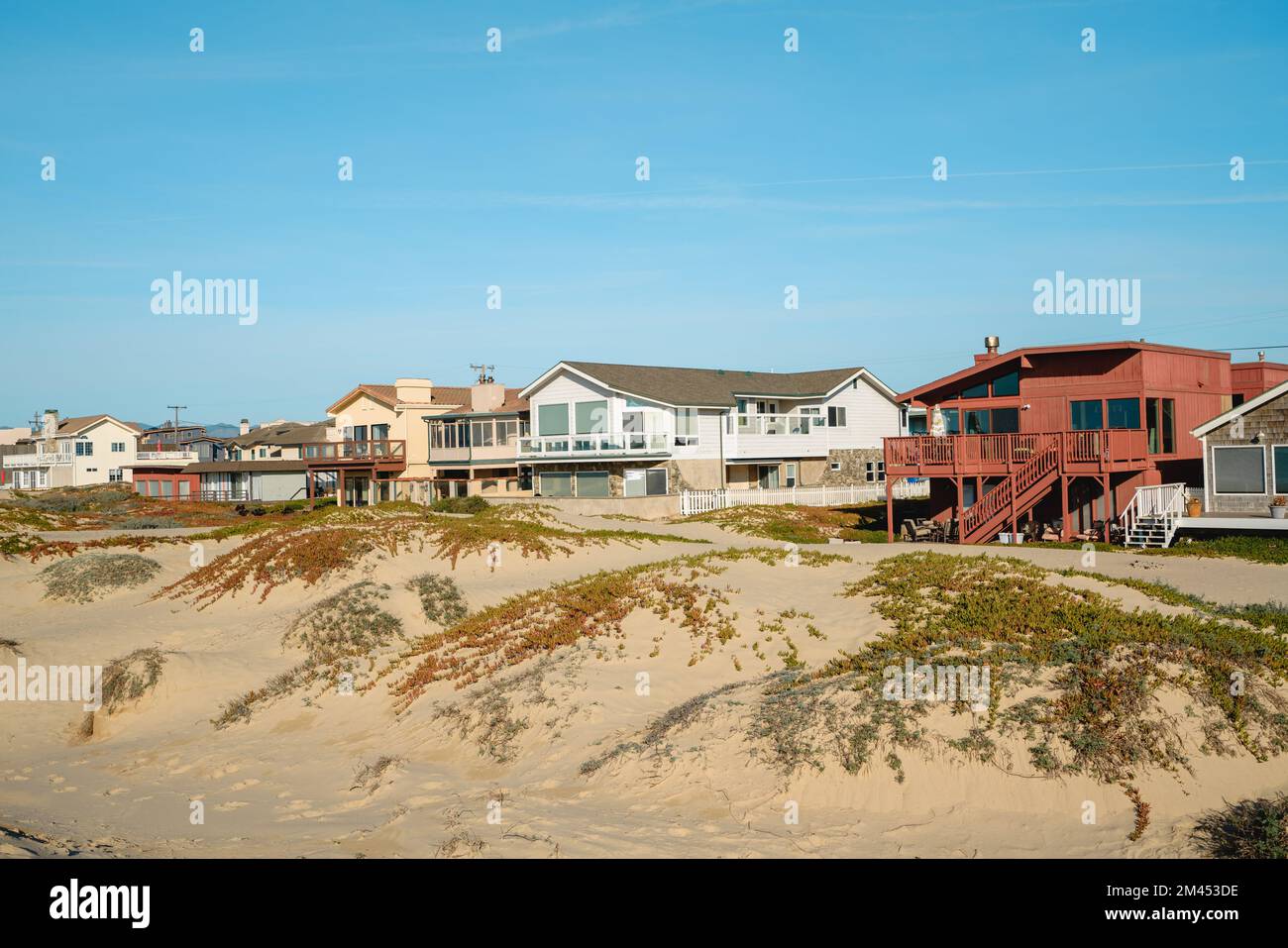 Houses that are set amid coastal sand dunes. Beautiful houses with ...