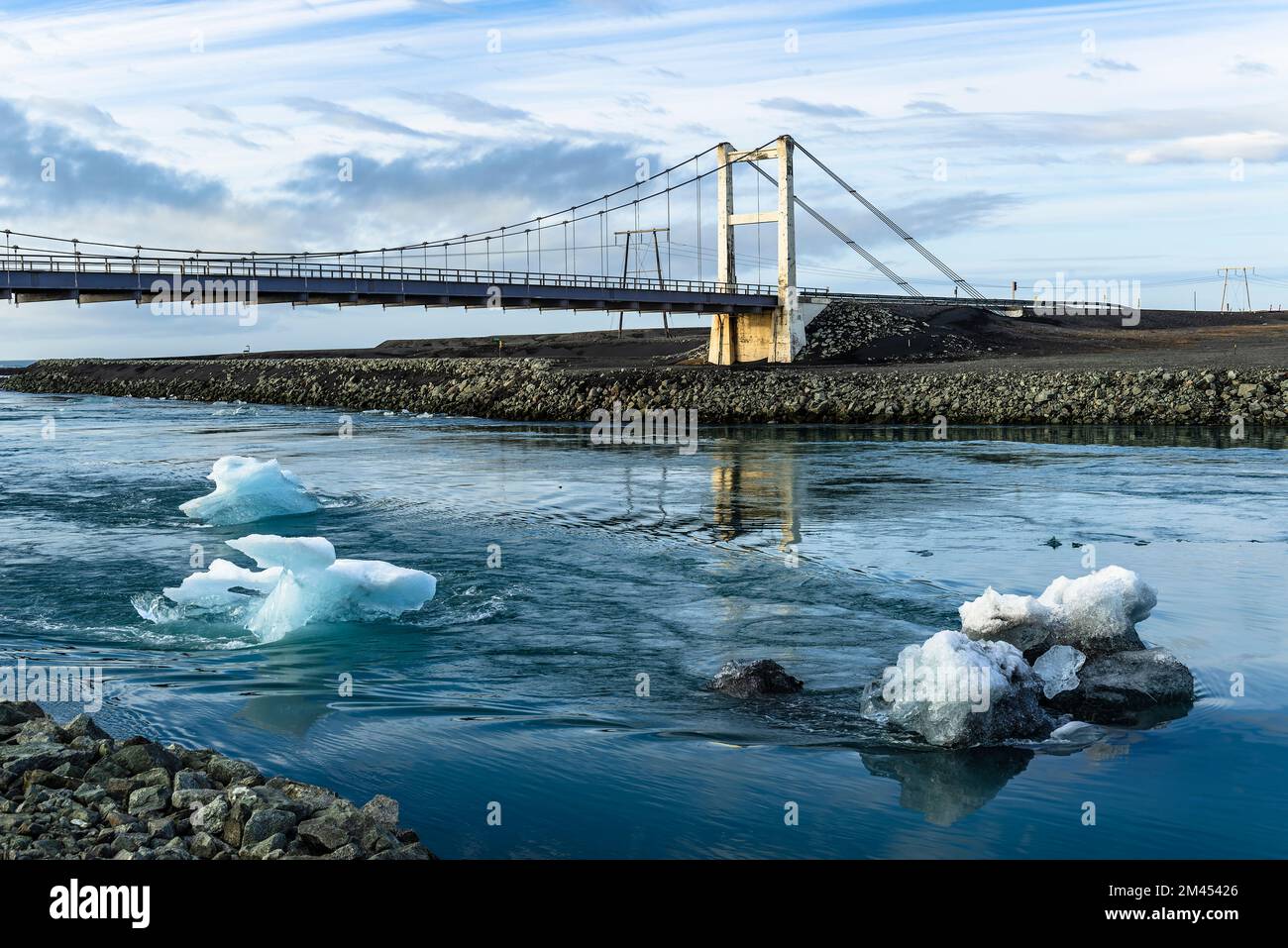 Icebergs floating towards the suspension bridge of Route 1 / Hringvegur ...