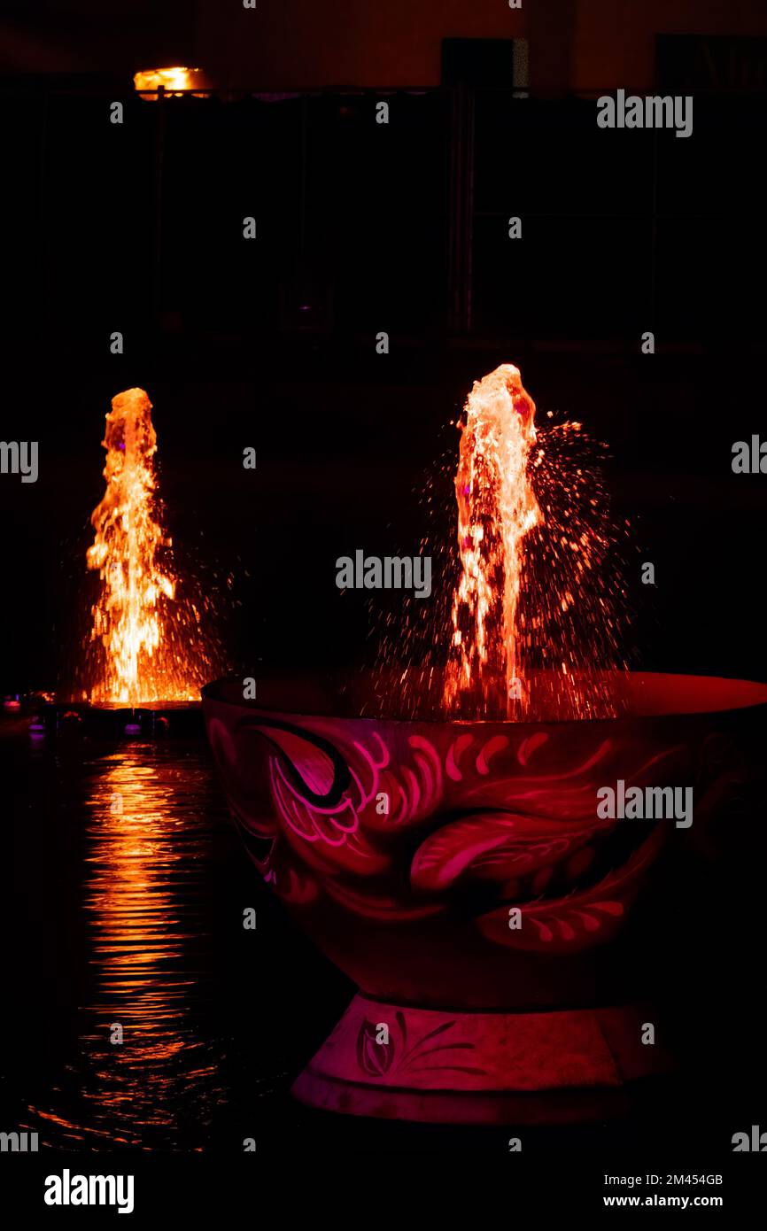 water jets with orange light at night, handmade painted vase Stock ...