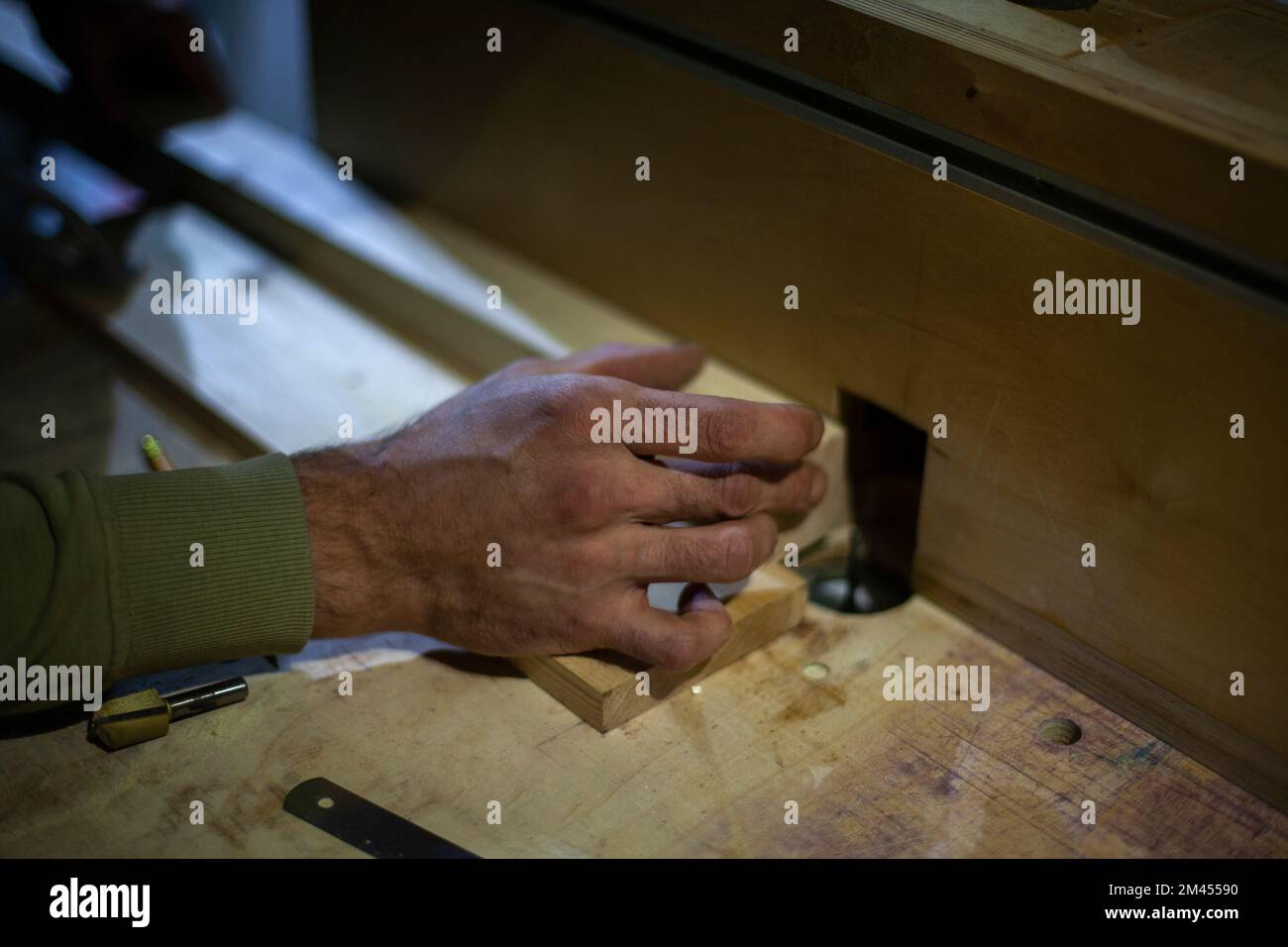 Wood processing. Carpenter's hand. Details of work in carpentry ...