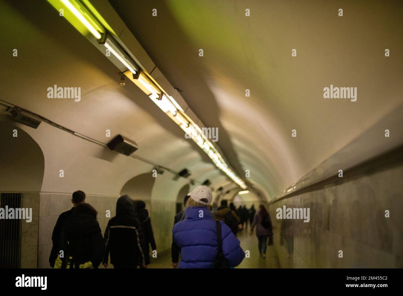 People walk in subway tunnel. People are walking on pedestrian crossing ...