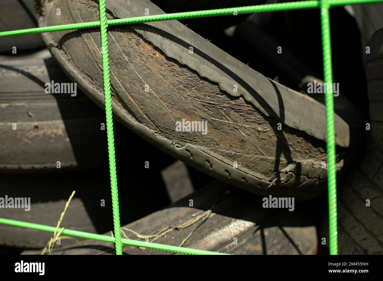 Old tires. Used wheels. Discarded rubber from car. Landfill details ...