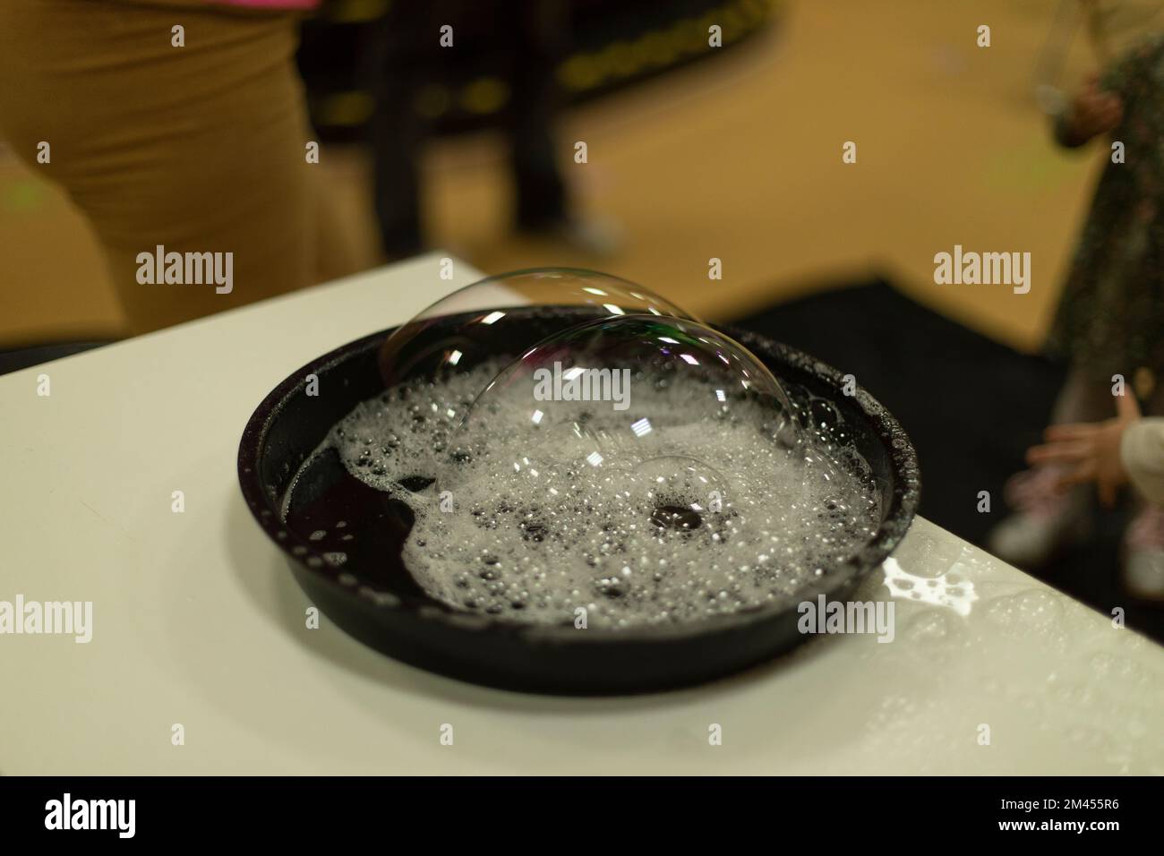 Bubbles. Soap solution for inflatable bubbles. Liquid for entertainment ...