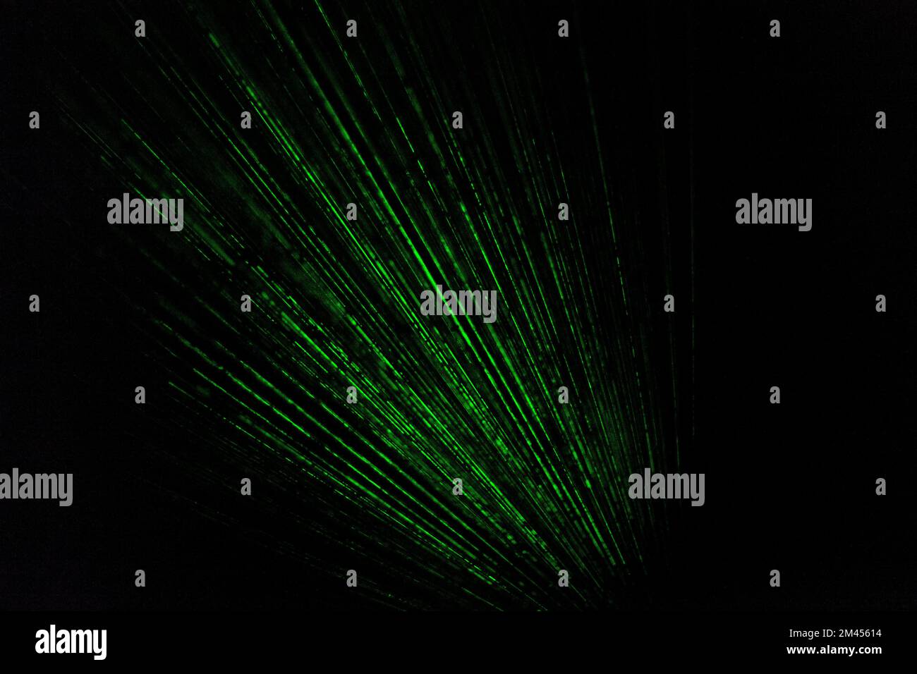 Laser beams in dark. Green rays on black background. Light music bright ...