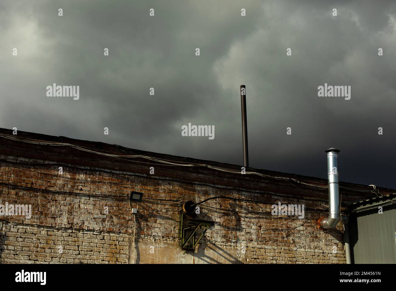 Roof of building with pipe. Brick house. Industrial Building Details ...