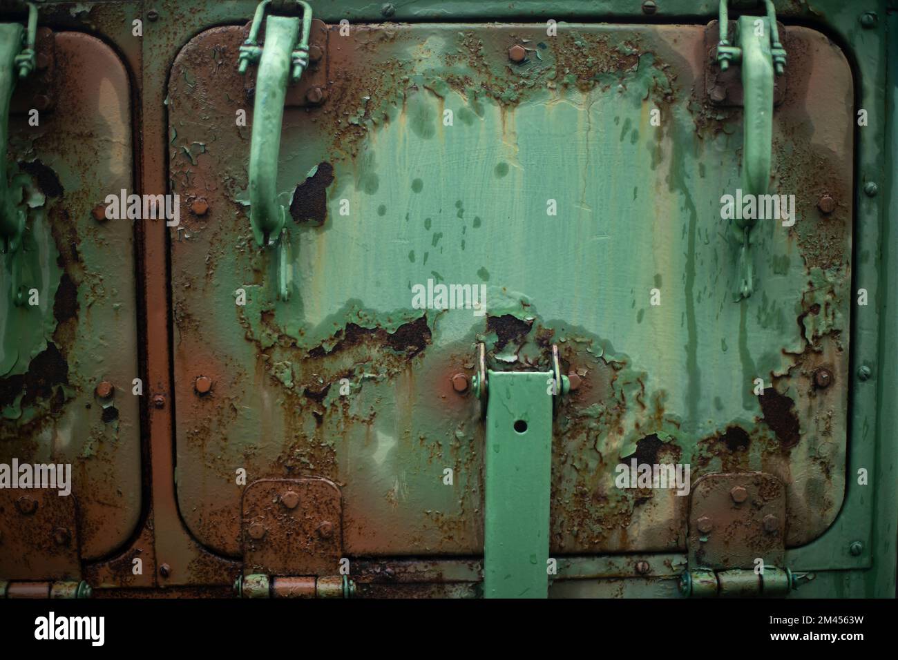 Rusty steel. Hatch door. Old military transport in detail. Rusty ...