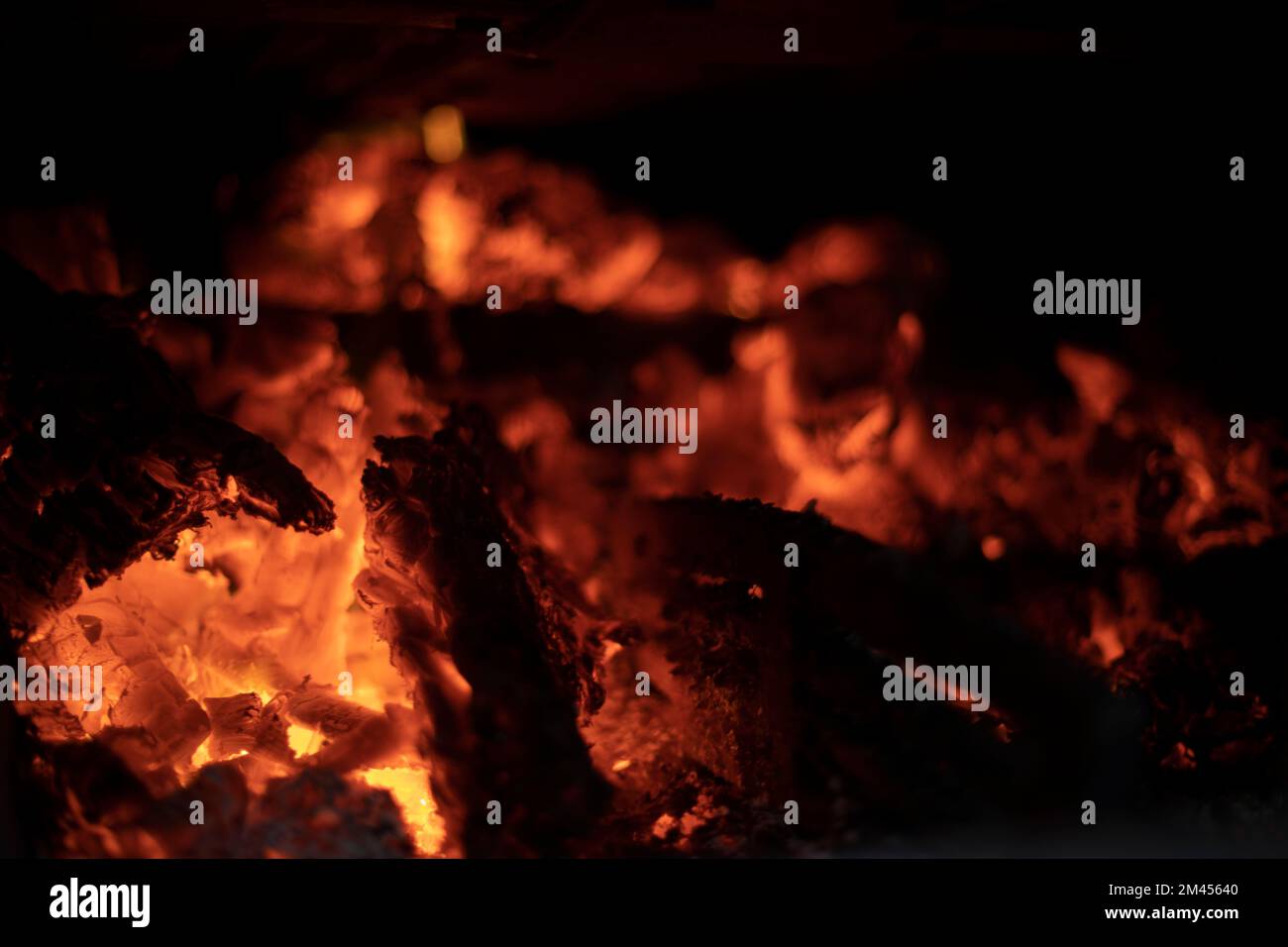 Burning of firewood in hearth. Flames of pyre. Texture of fire inside ...