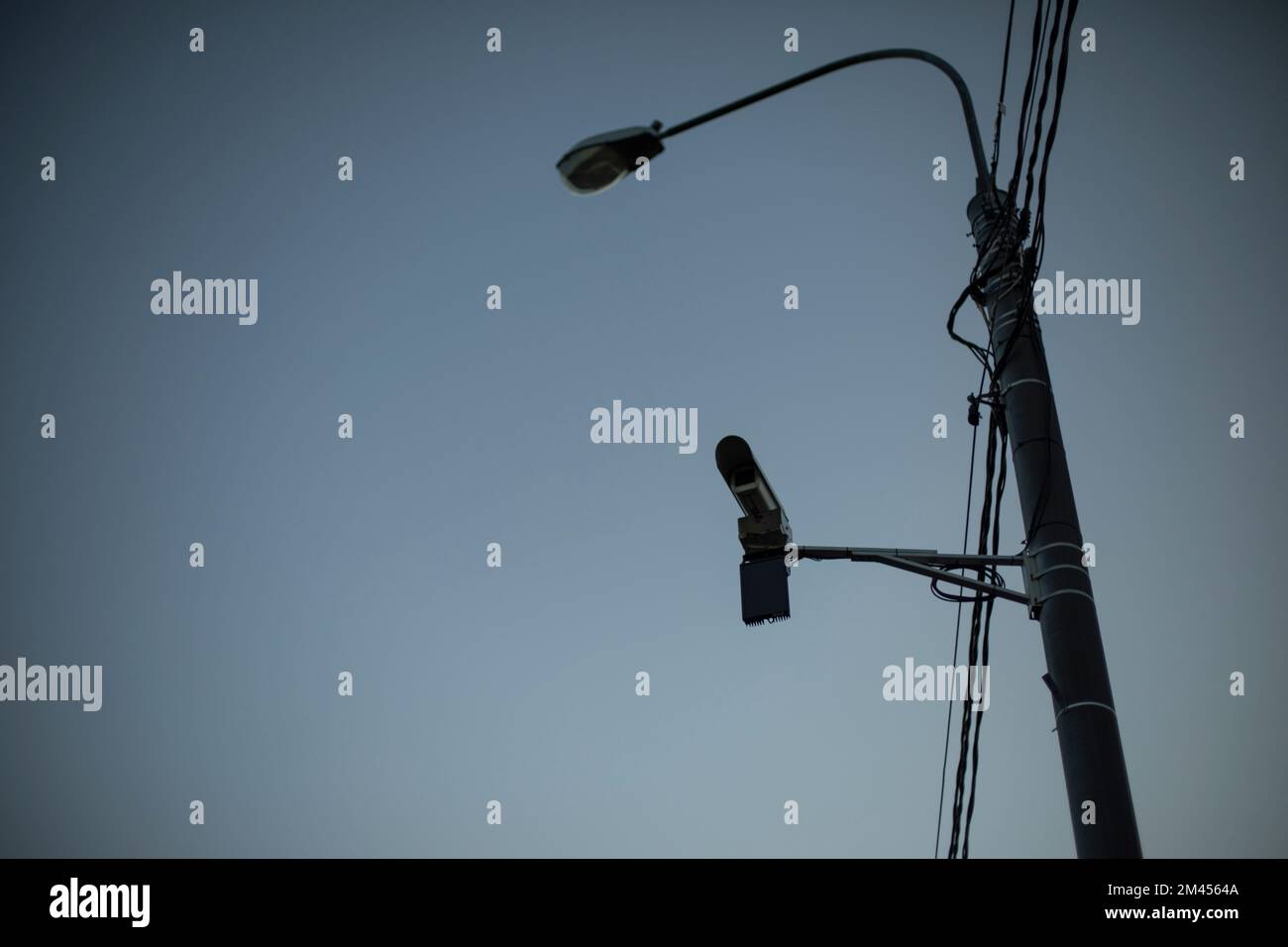 Camera on pole. Video surveillance on pole. Shooting road from height ...