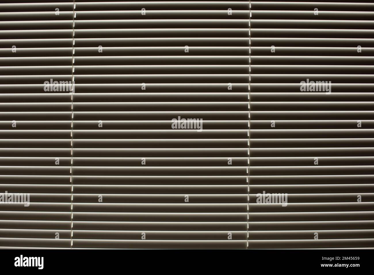 Blinds on window. Daylight through slats of blinds. Texture window ...