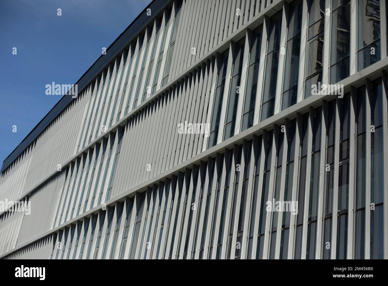 Building is outside. Windows in building. Vertical lines in ...