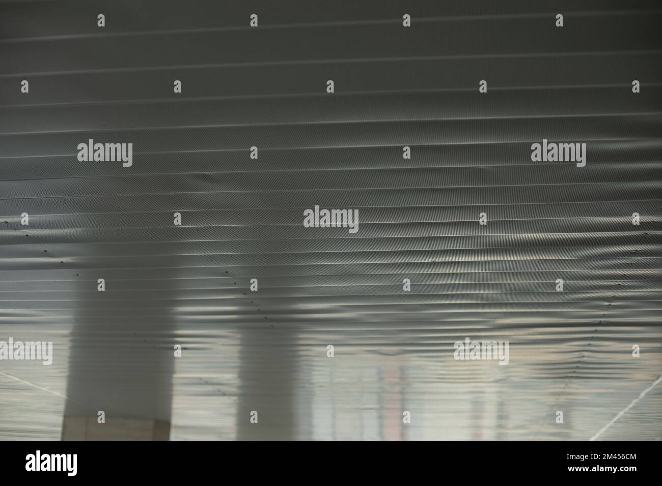 Ceiling of building canopy. White ceiling. Architectural details. Shop ...