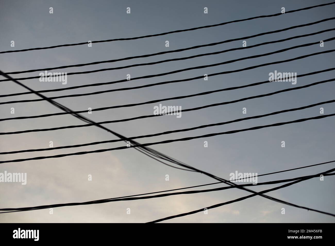 Electrical wires on pole. Many wires against sky. High voltage pole ...