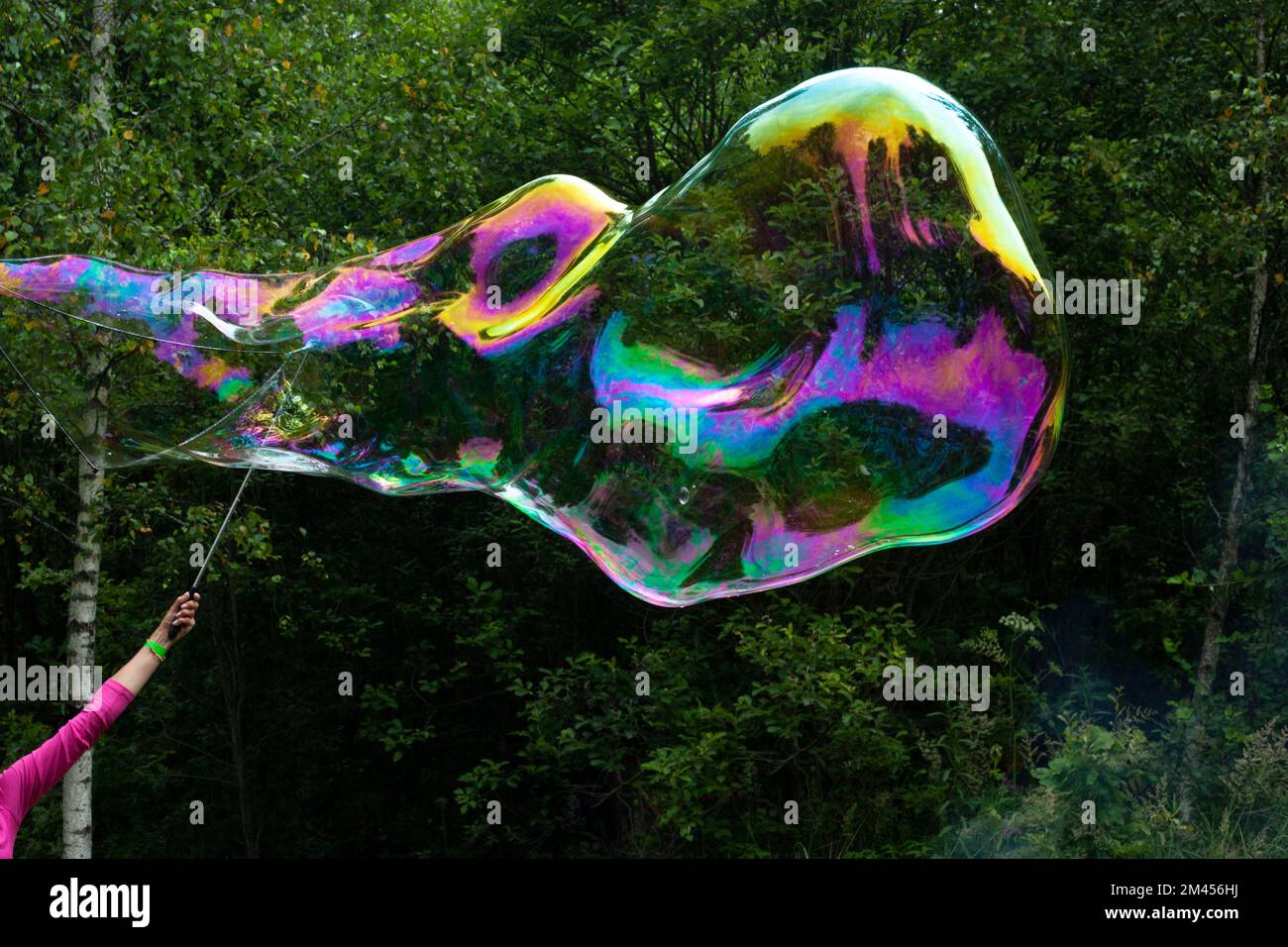 Big bubble. Transparent soap film. Details of holiday. Huge bubble ...