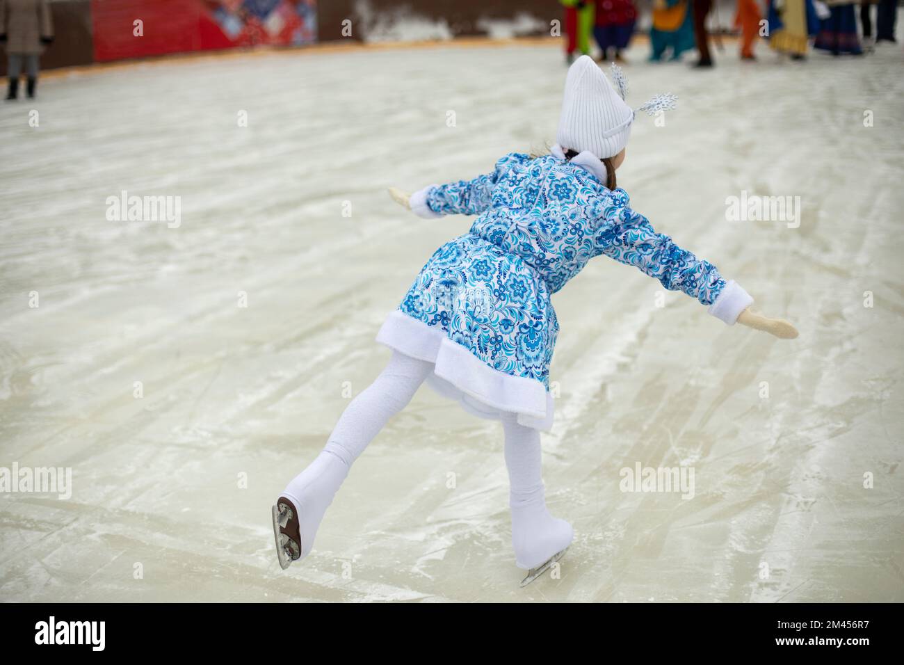 Child on ice. Skater. Sports. Figure skating on ice. Winter holidays ...