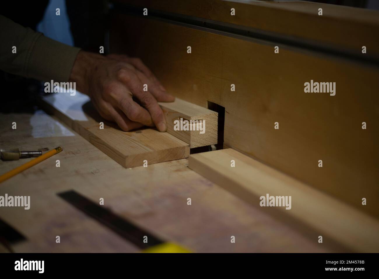 Wood processing. Carpenter's hand. Details of work in carpentry ...